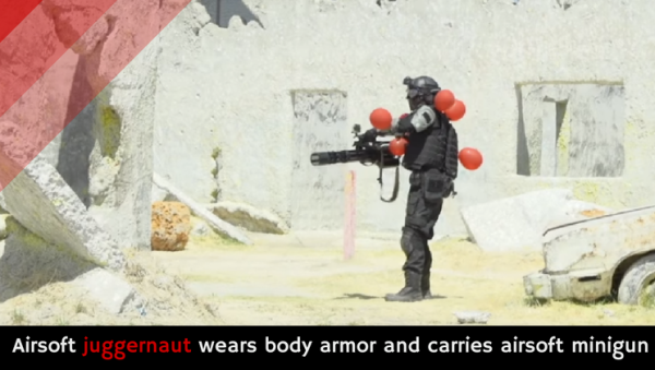Airsoft juggernaut wears body armor and carries airsoft minigun ...
